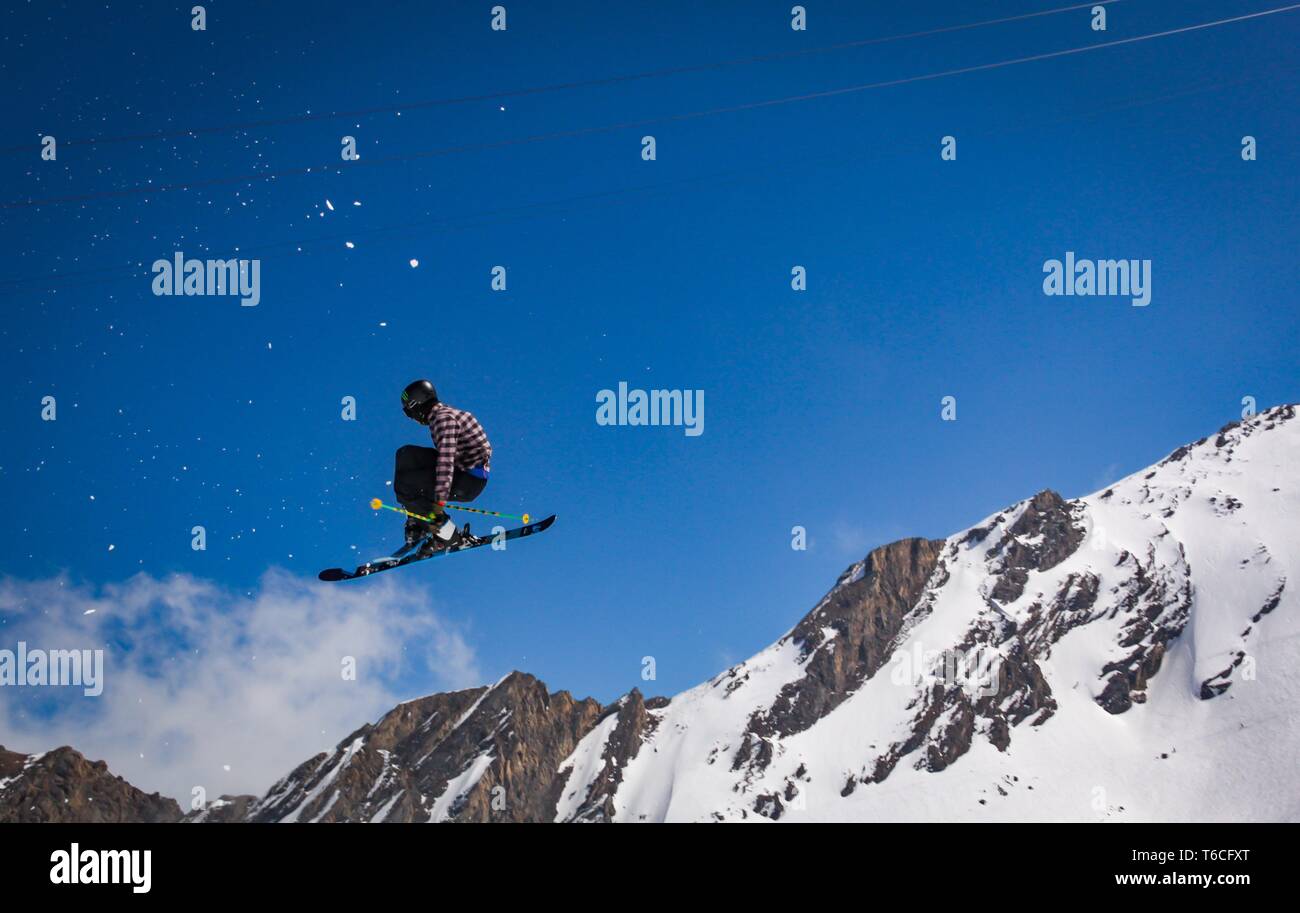 Skier jumping on snowy slope hi-res stock photography and images - Alamy