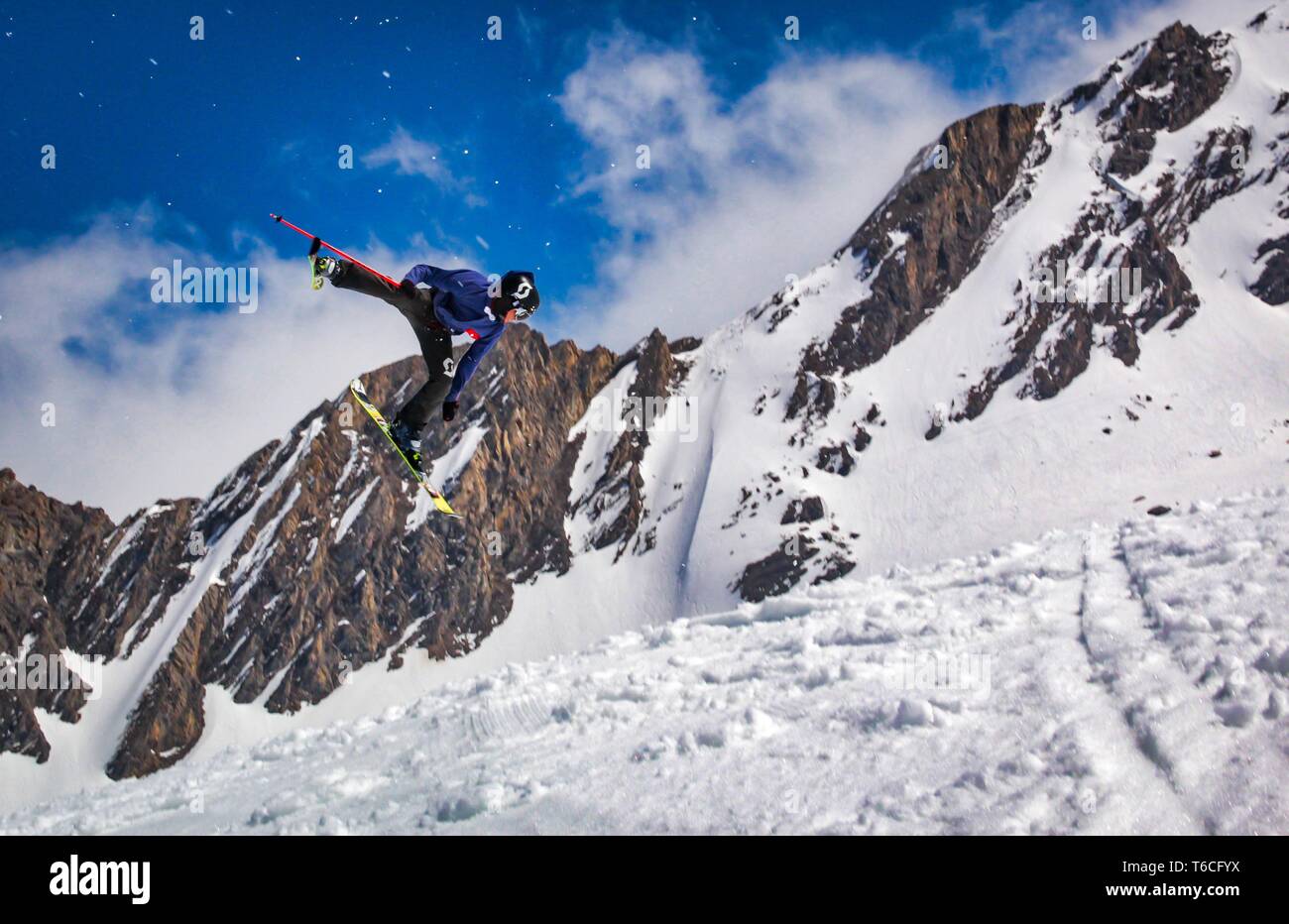 Skier jumping on snowy slope hi-res stock photography and images - Alamy