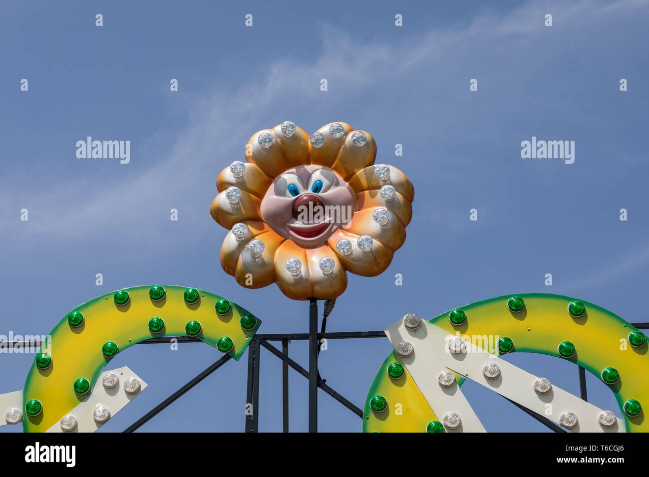 Flower with smiling face at fairground Stock Photo - Alamy