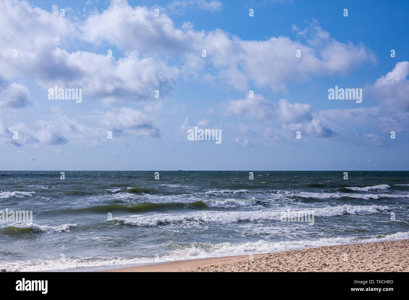 Empty beach, waves and dramatic sky at the Baltic sea shore line, Lithuania, Klaipeda Stock ...