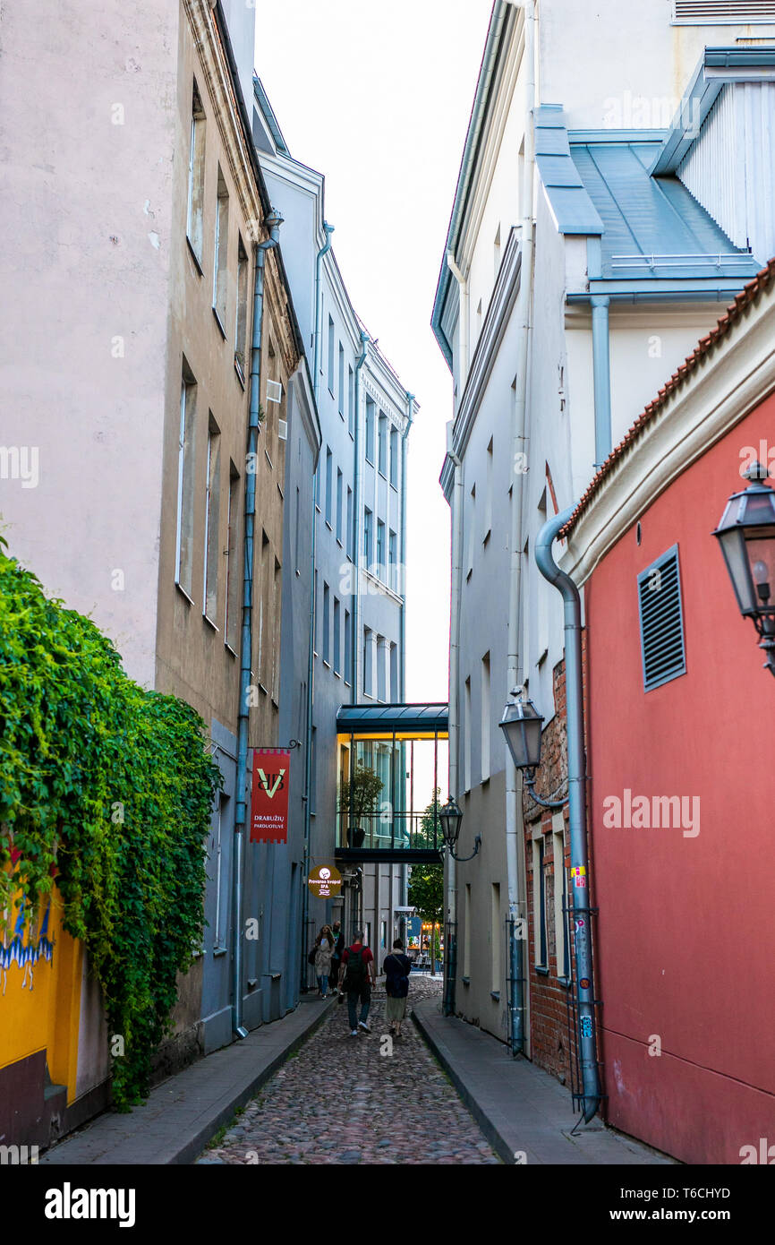 Tourists visit one of the most popular Pilies street of the old town ...