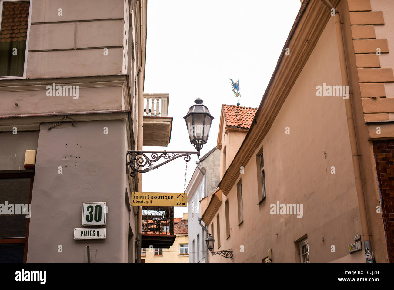 Tourists visit one of the most popular Pilies street of the old town ...