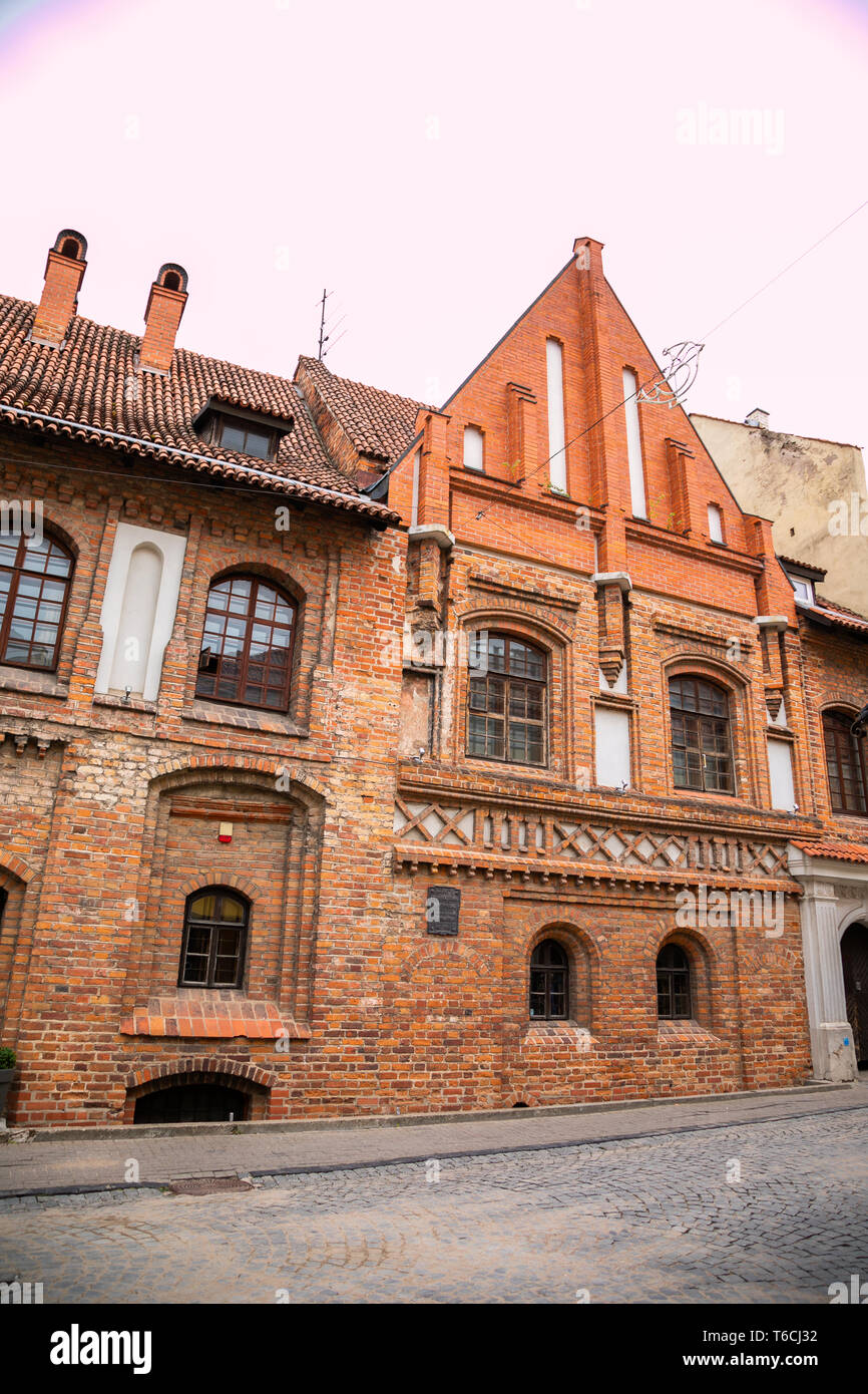 Tourists visit one of the most popular Pilies street of the old town ...