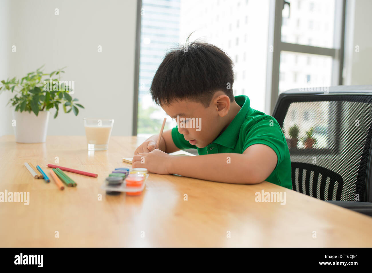 Thoughtful little student studying in the morning Stock Photo - Alamy
