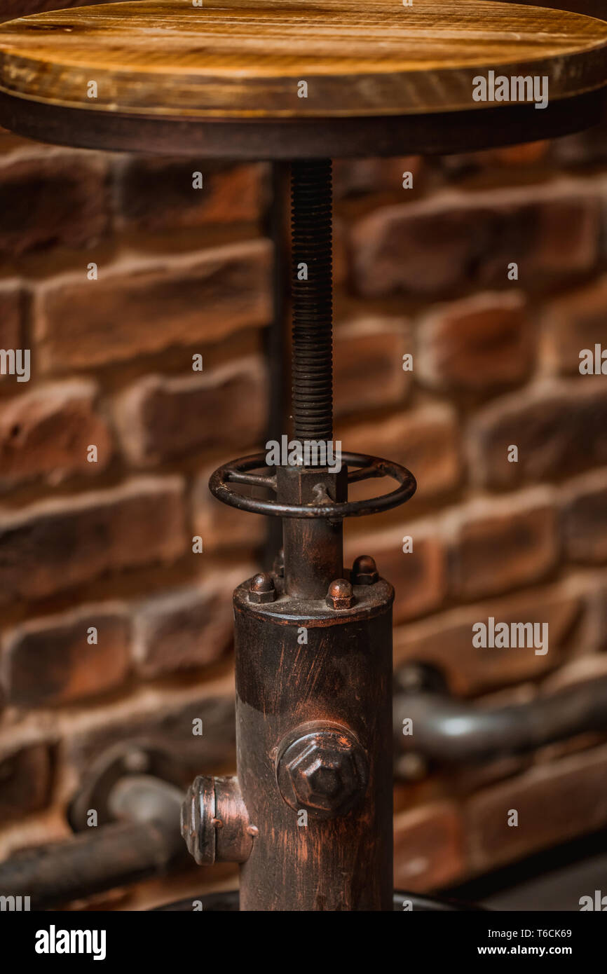 abstract wooden and metal stool on a bar in a brewery, switzerland ...