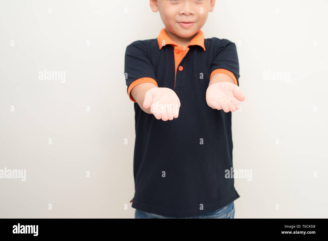 little boy offering something Stock Photo - Alamy