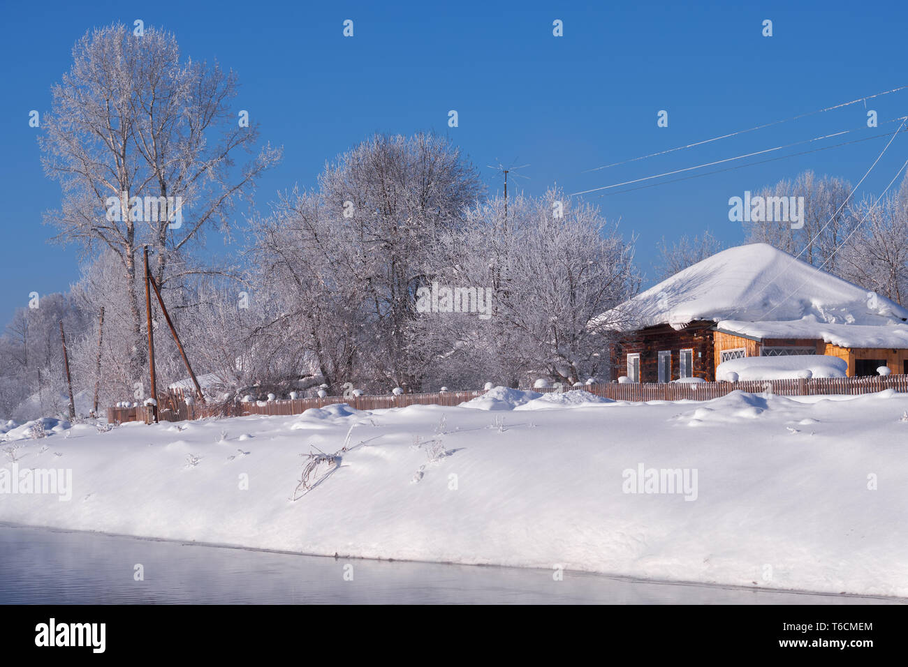 Altai russian country village Talitsa under winter snow on bank of ...