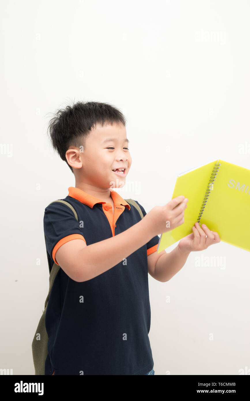 Happy little boy with book isolated on white background Stock Photo - Alamy