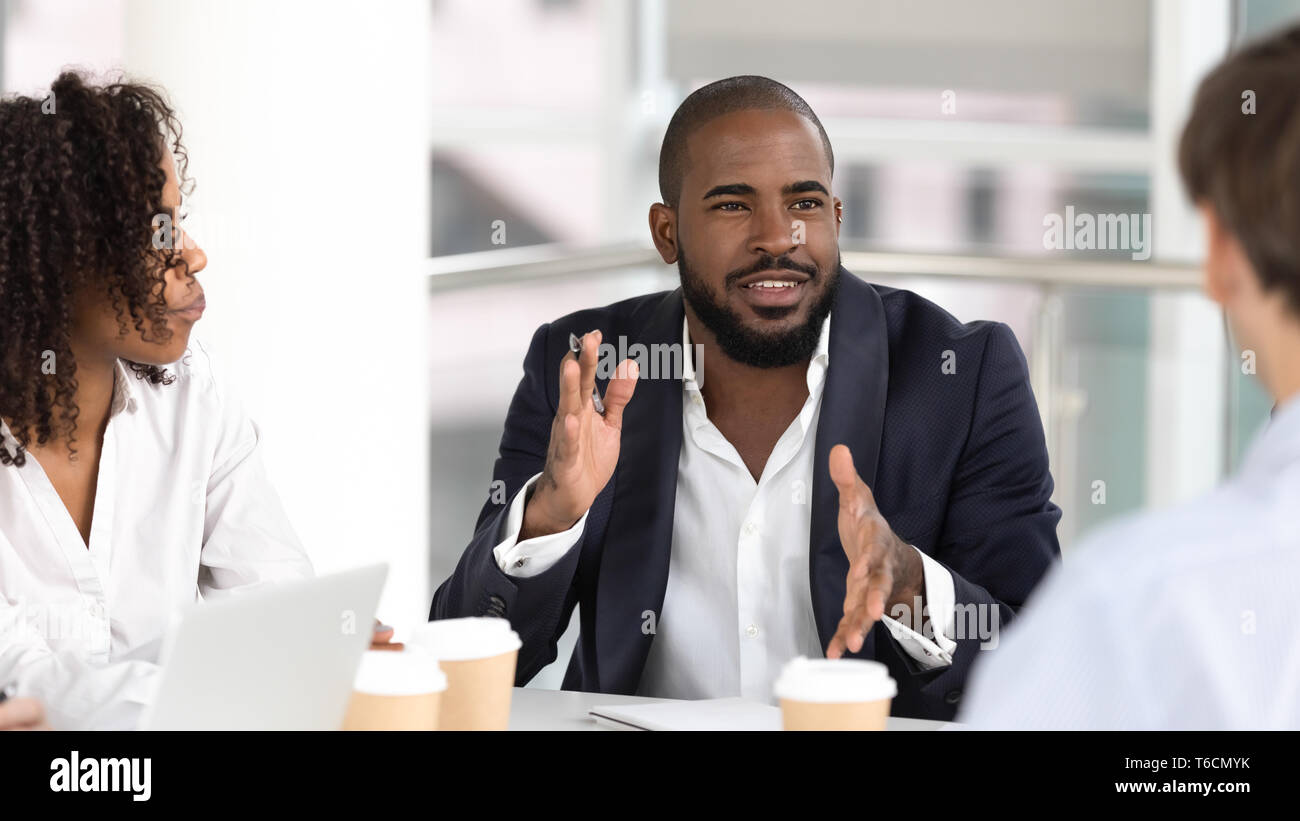 Black boss speaking to employees hi-res stock photography and images ...