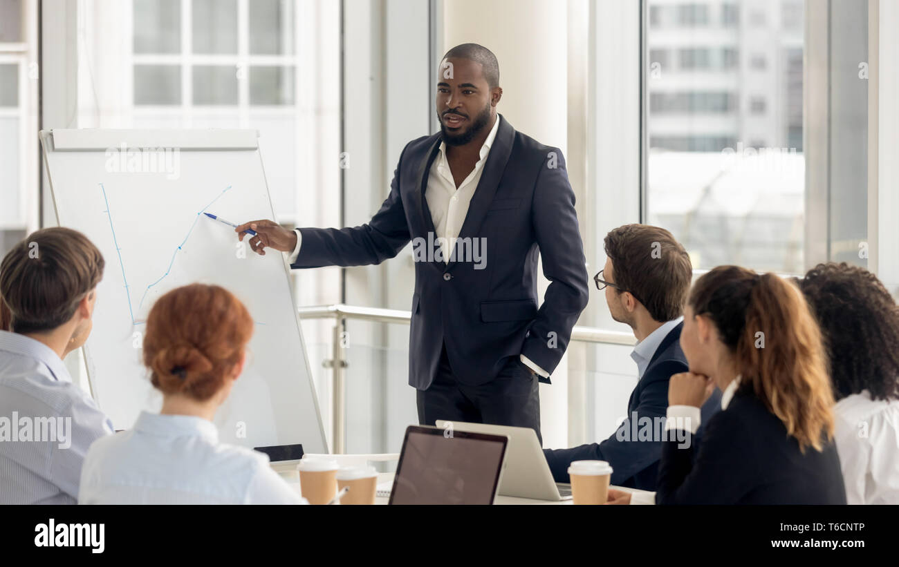 African american coach talking to audience giving presentation on ...