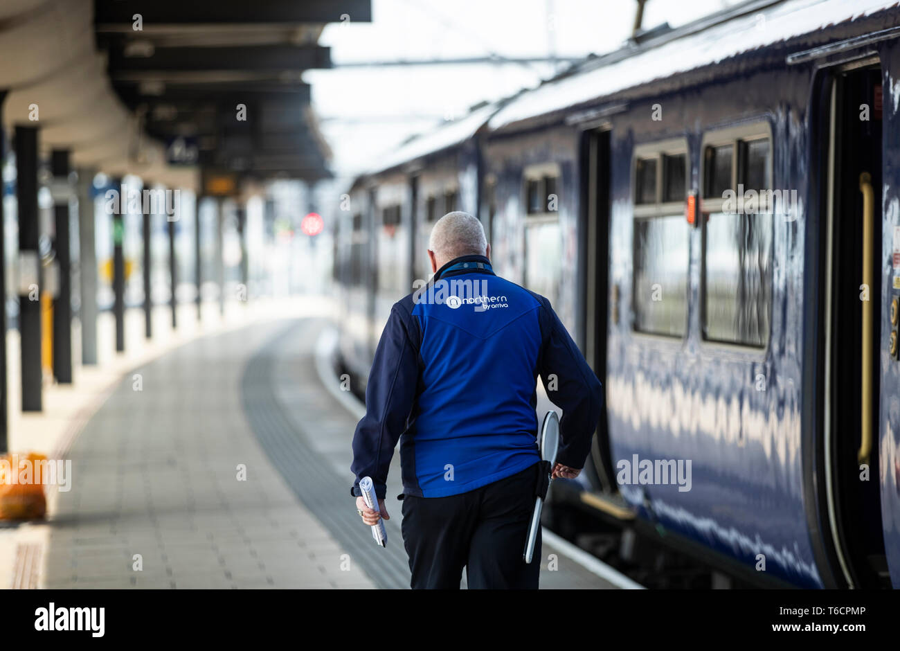 A Northern employee at Leeds train station Stock Photo - Alamy