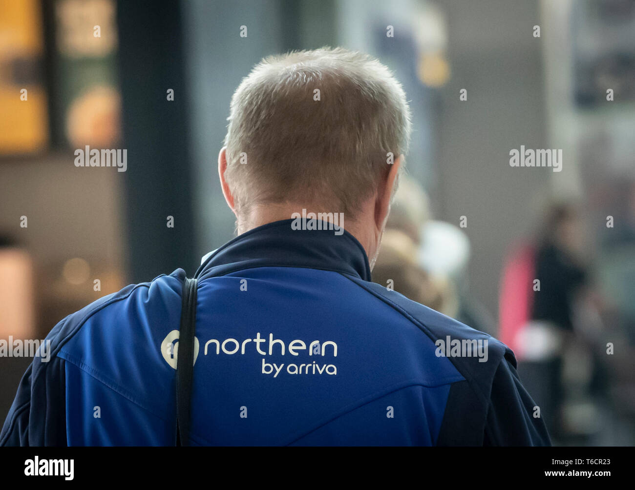 A Northern employee at Leeds train station Stock Photo - Alamy