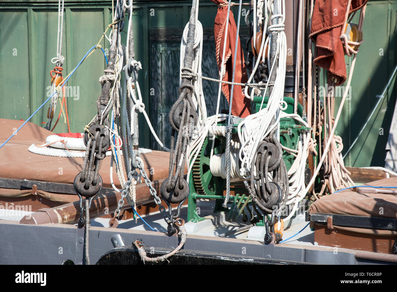 Lots of ropes to pull on the rigging of a sailing ship Stock Photo - Alamy