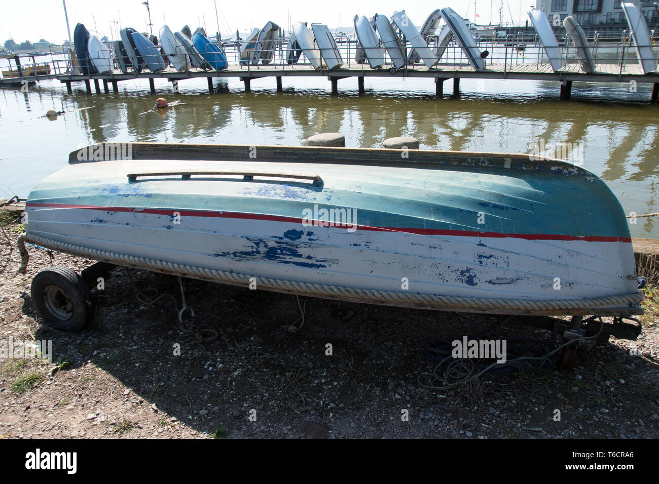 Rowing boat on the quay upside down Stock Photo - Alamy