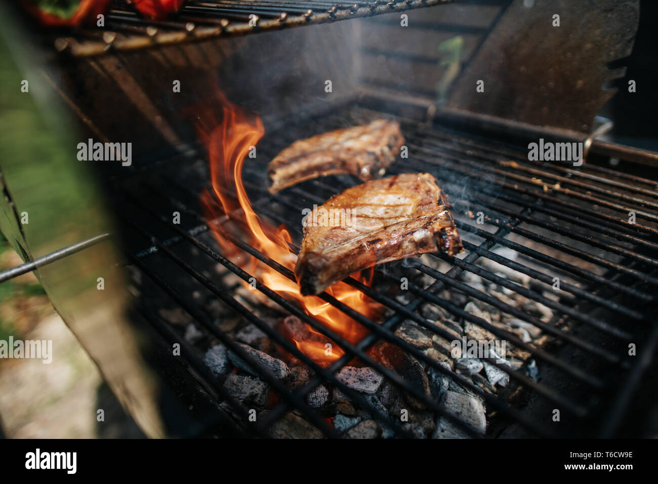 two Iberico chops on a grill with high flame Stock Photo - Alamy