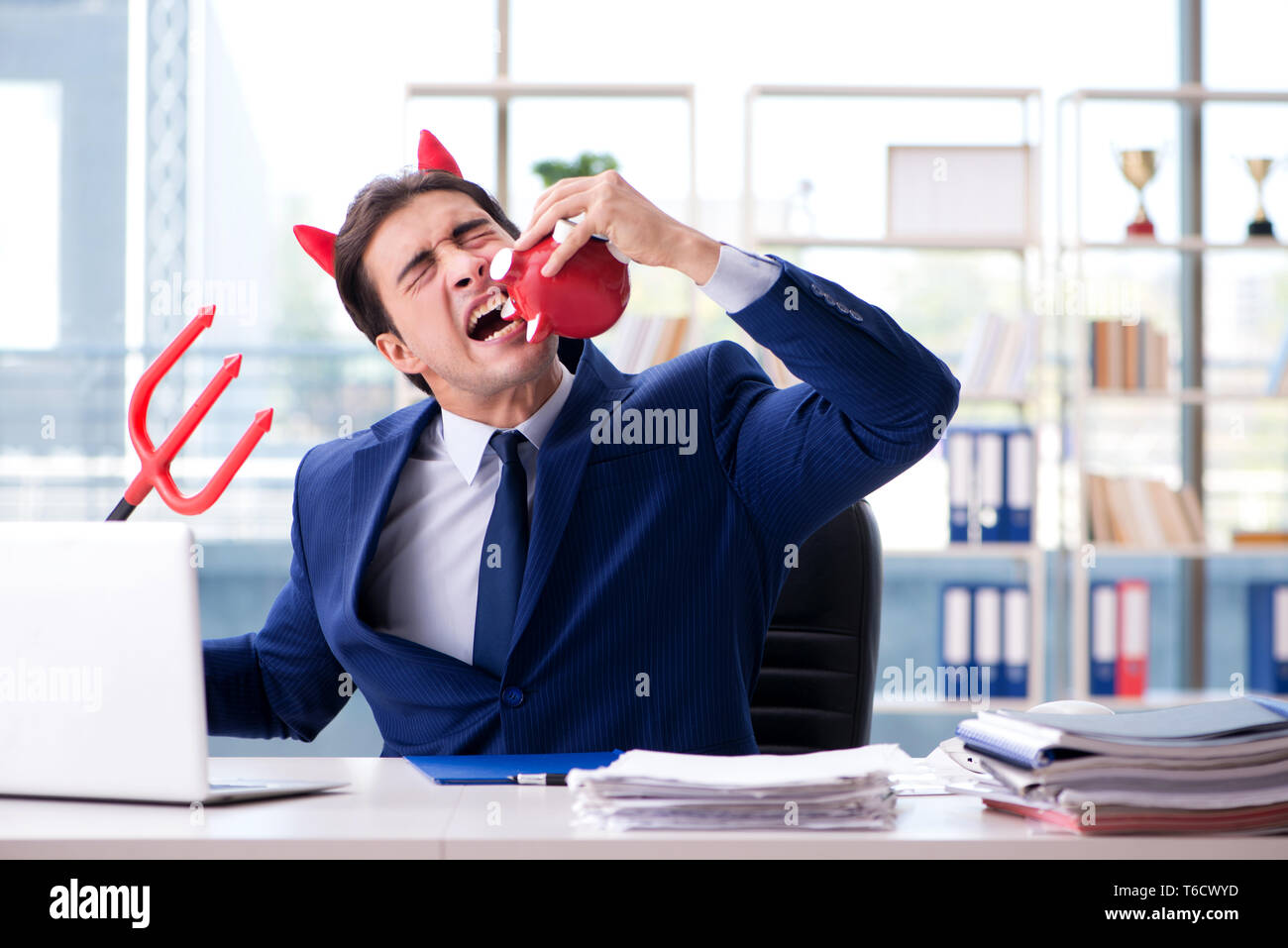 Devil angry businessman in the office Stock Photo - Alamy