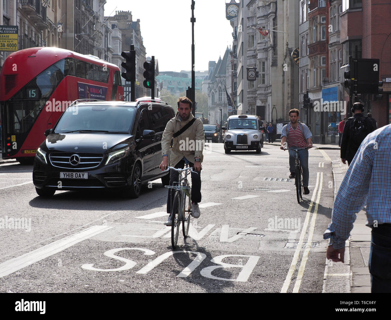Cycling in bus lane, London, England, UK Stock Photo - Alamy