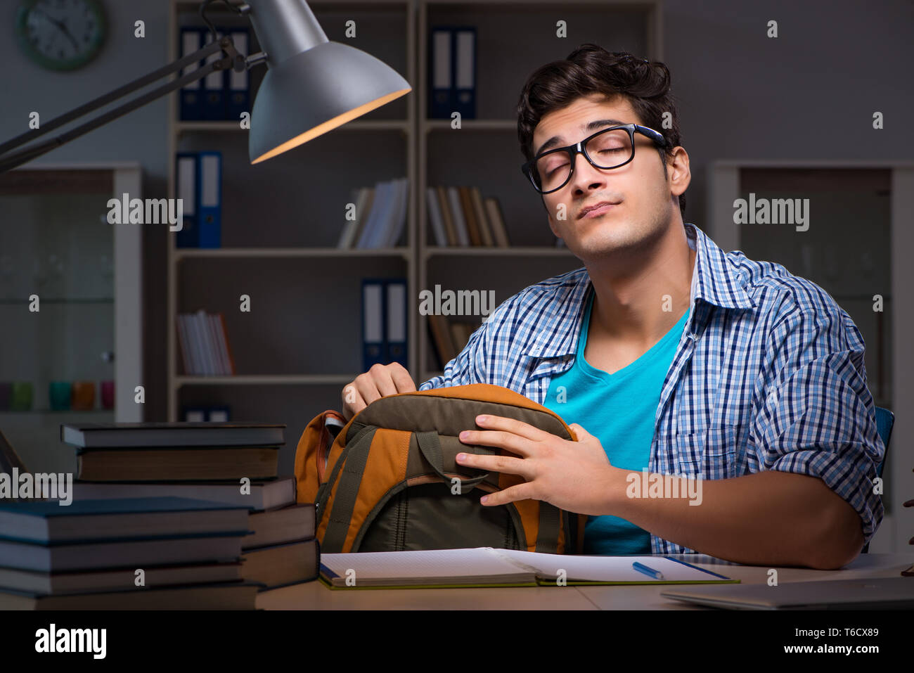 Student preparing for exams late night at home Stock Photo - Alamy