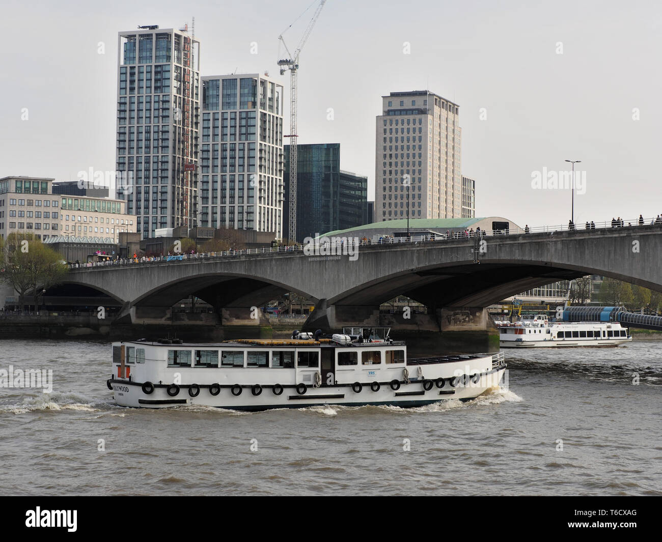 Ferry on the river Thames & Waterloo Bridge, London, England, UK Stock ...