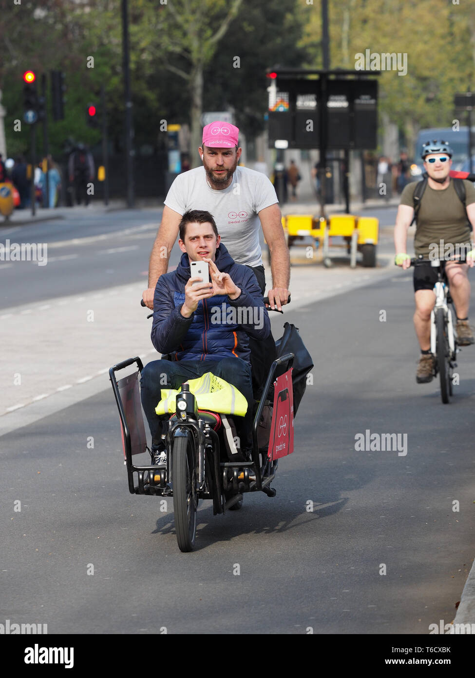 Cycle taxi with passeger sightseeing in London, England, UK Stock Photo ...