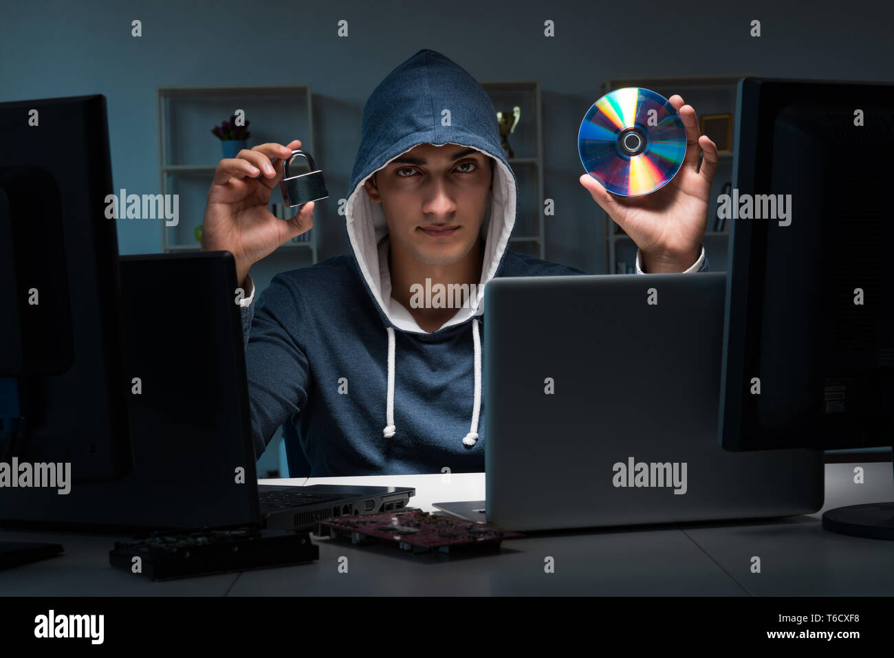 Hacker hacking computer at night Stock Photo - Alamy