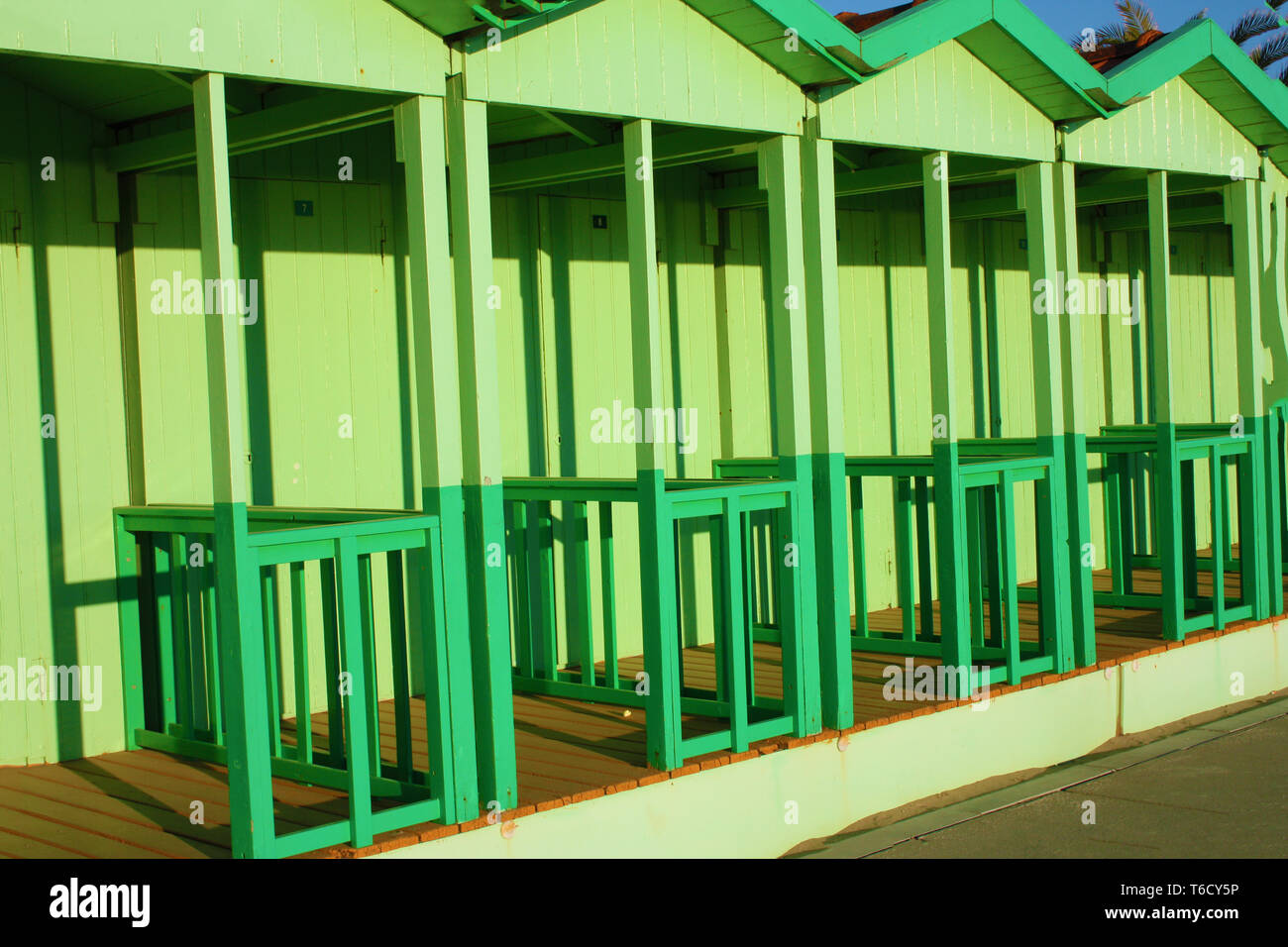 bathing huts at the sea in green color. booths for changing clothes ...