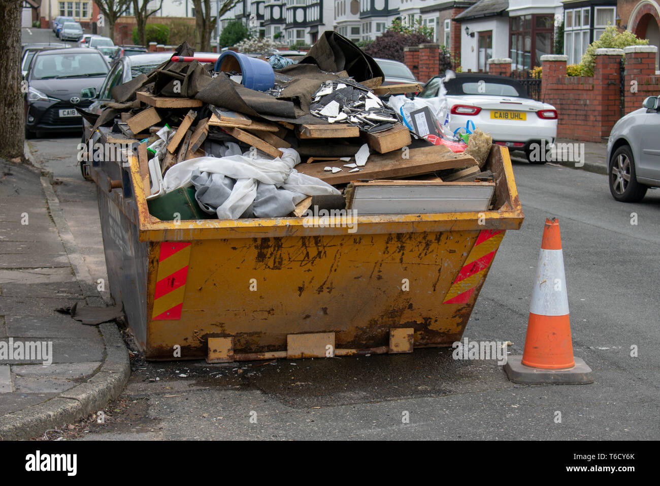Yellow metal skip full of garbage in Penarth, United Kingdom Stock ...