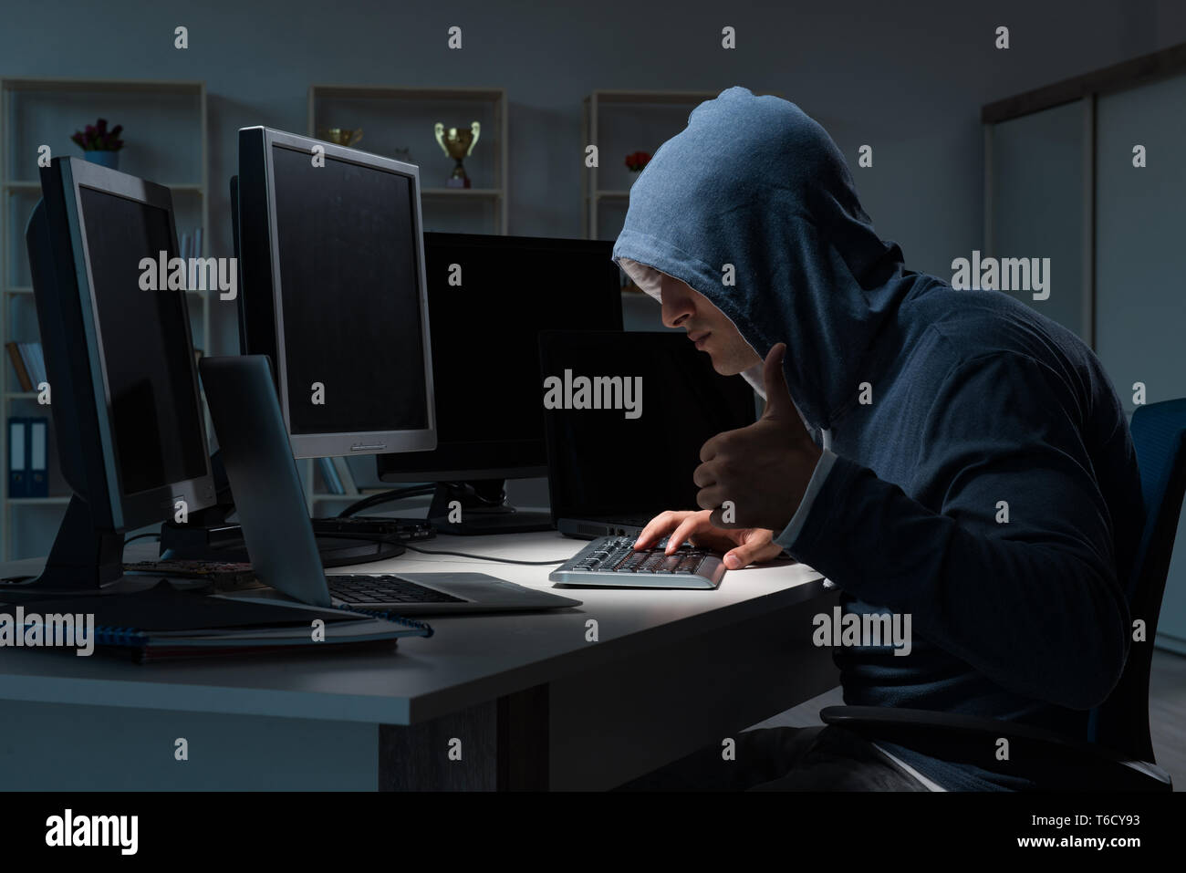 Hacker hacking computer at night Stock Photo - Alamy