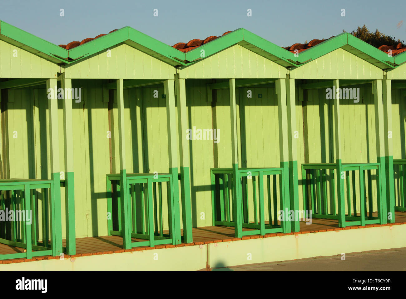bathing huts at the sea in green color. booths for changing clothes ...