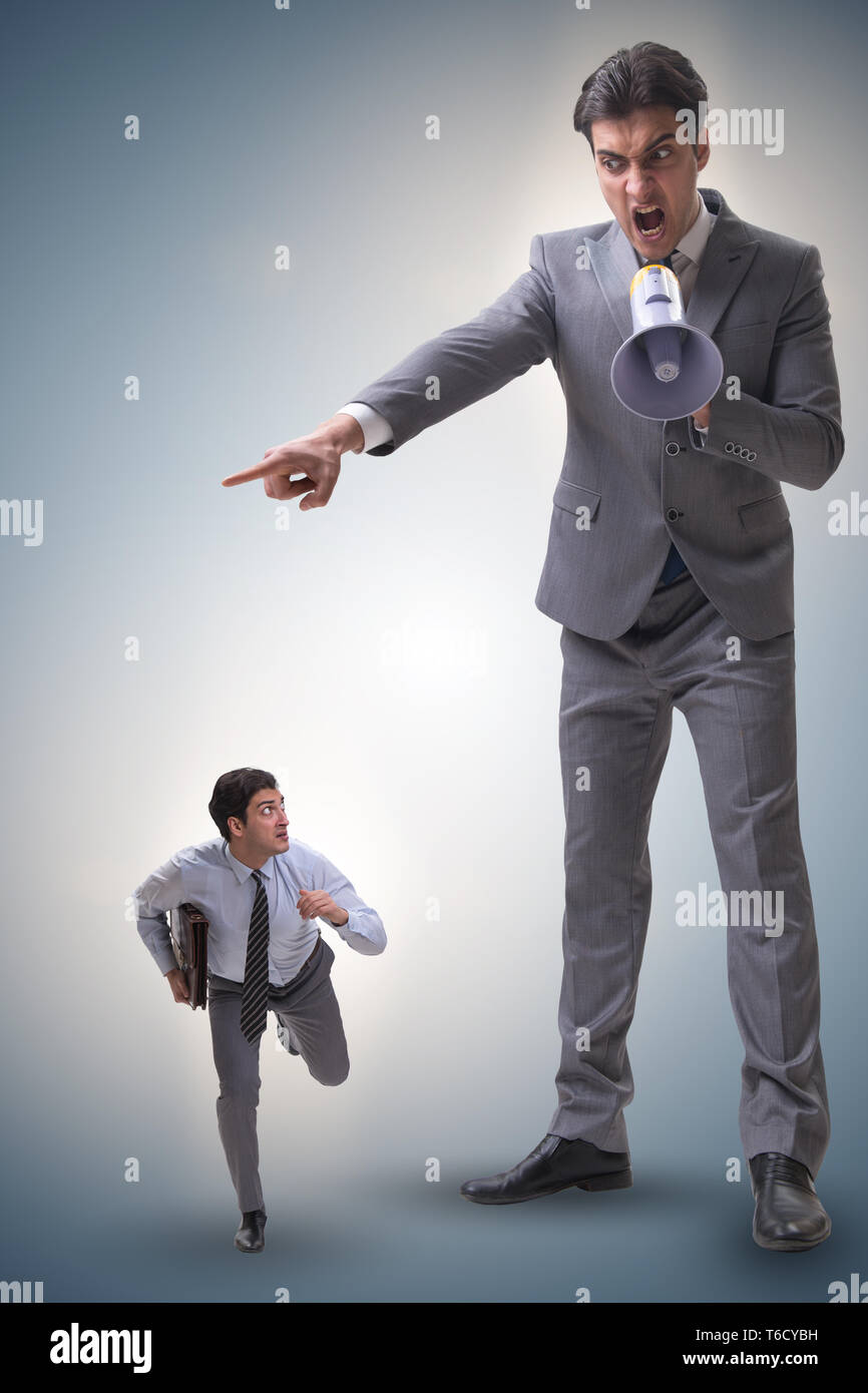 Bad angry boss shouting at employee with loudspeaker Stock Photo - Alamy