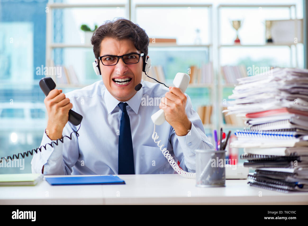 Call centre worker unhappy hi-res stock photography and images - Alamy