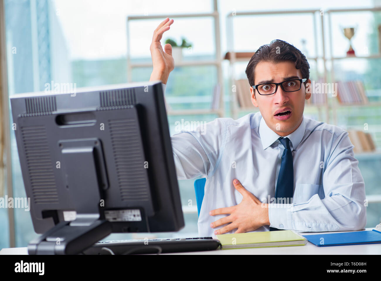 Businessman suffering from excessive armpit sweating Stock Photo - Alamy