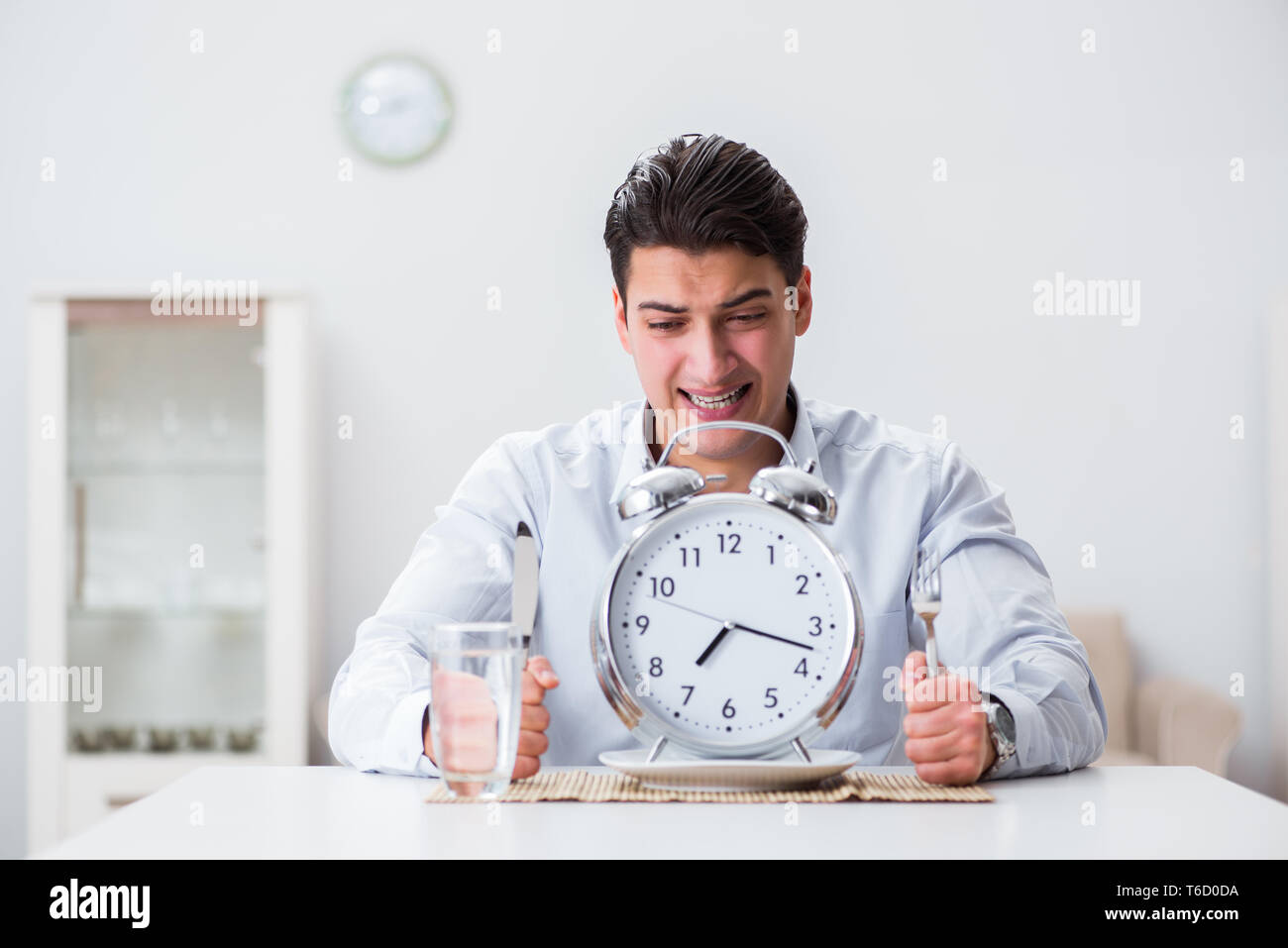 Angry man waiting food in hi-res stock photography and images - Alamy
