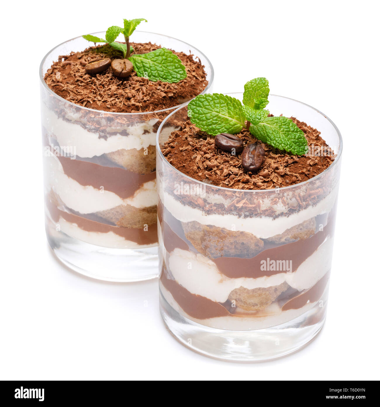 two portions Classic tiramisu dessert in a glass isolated on a white ...