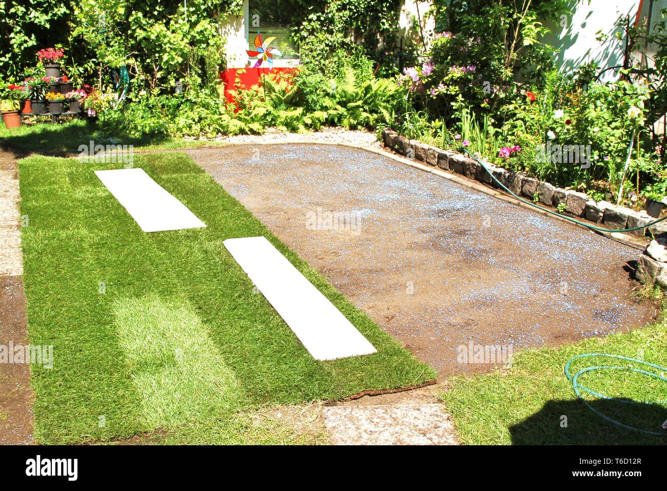 prepared ground for turf in the garden Stock Photo - Alamy