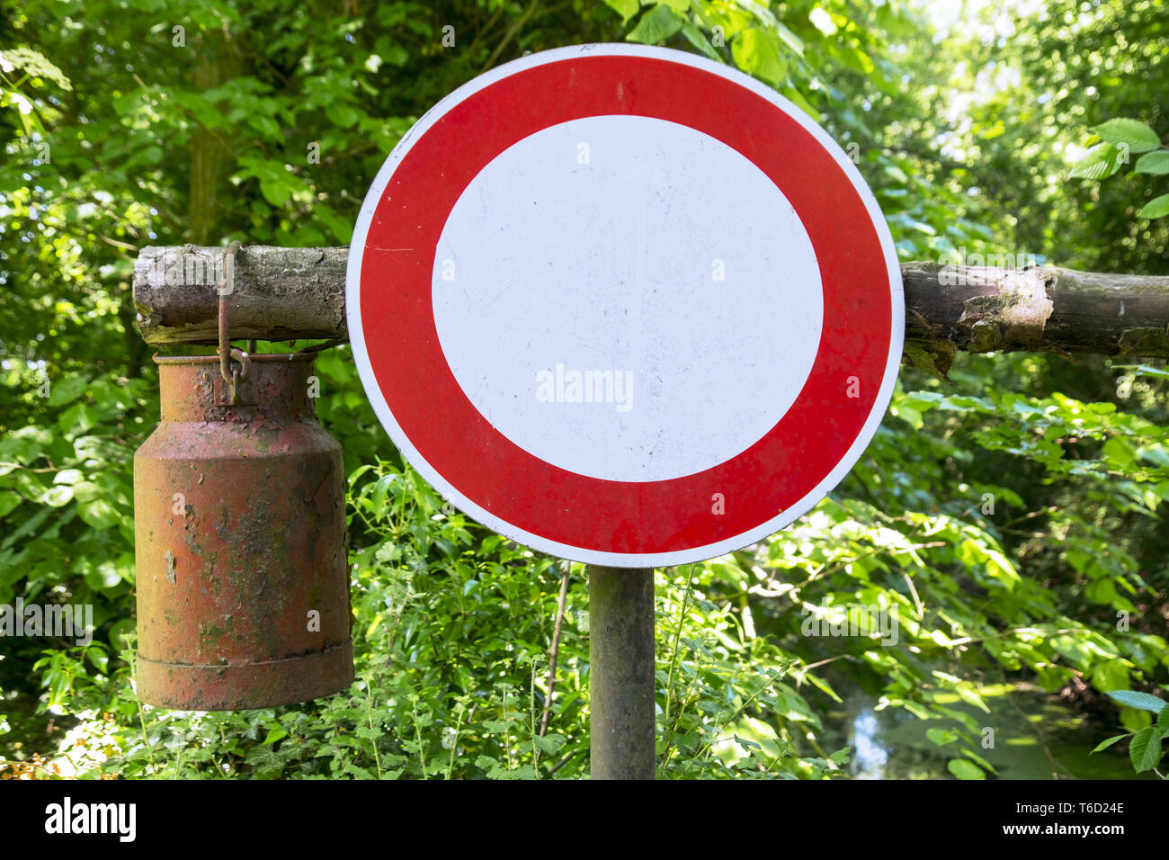Road sign, old milk can Stock Photo - Alamy