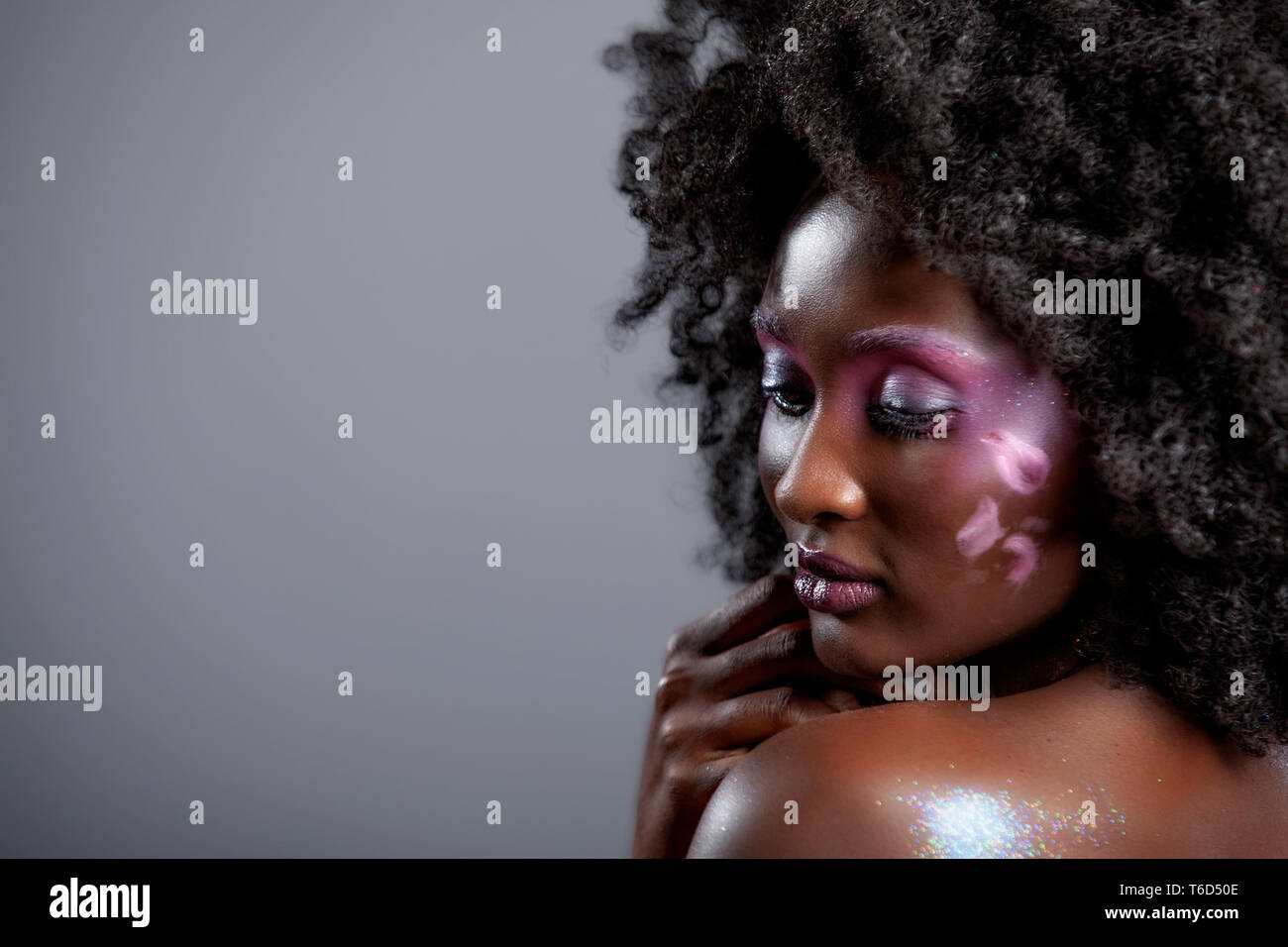 Afro and Flower beauty with big black hair smooth dark skin Stock Photo ...