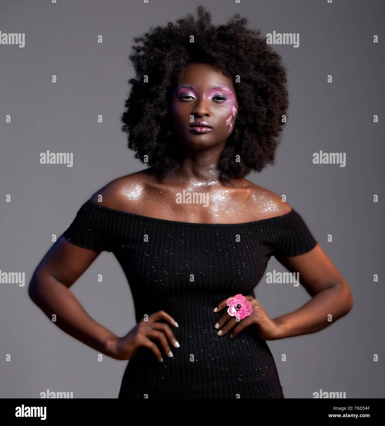 Afro and Flower beauty with big black hair smooth dark skin Stock Photo ...