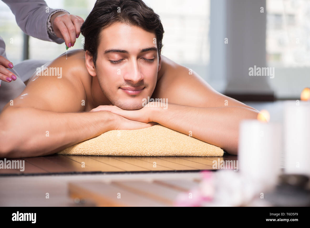 Young handsome man during spa procedure Stock Photo - Alamy