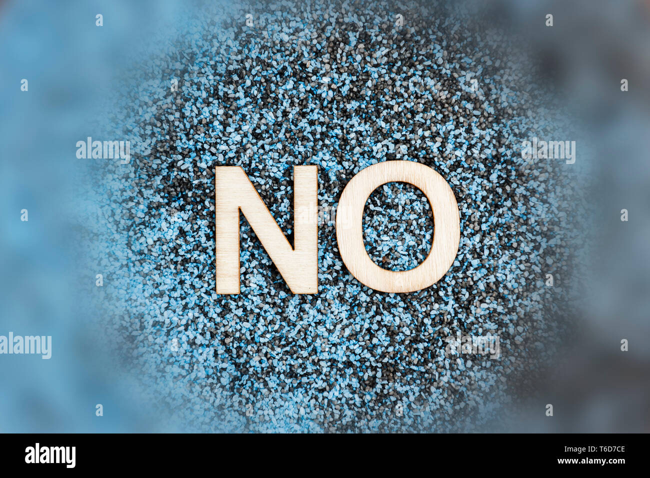 Mixed black and blue decorative sand to the outside in the soft focus ...