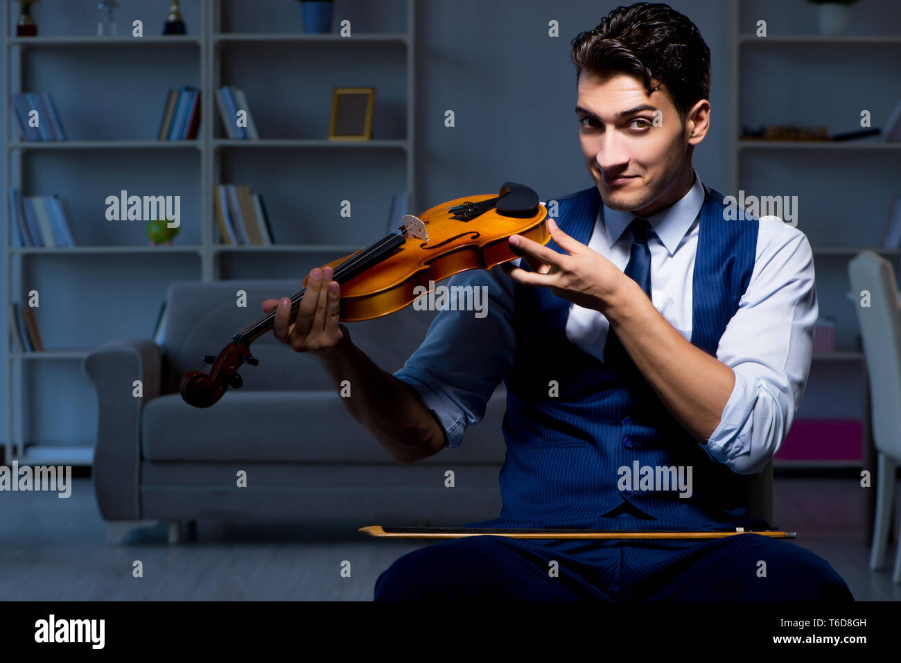 Young man playing violin night hi-res stock photography and images - Alamy