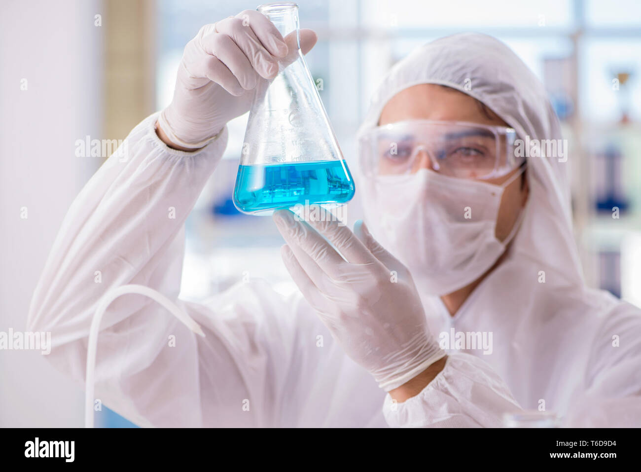 Chemist working in the laboratory with hazardous chemicals Stock Photo ...