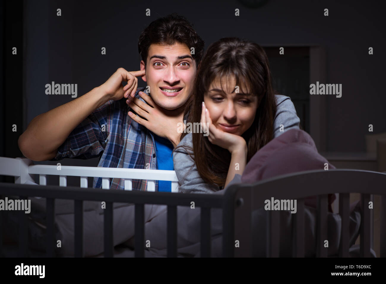 Young parents sleepless with newborn baby at night Stock Photo - Alamy