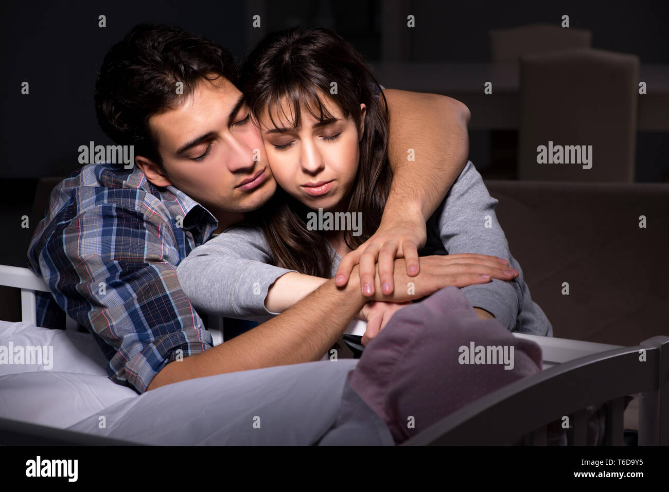 Young parents sleepless with newborn baby at night Stock Photo - Alamy