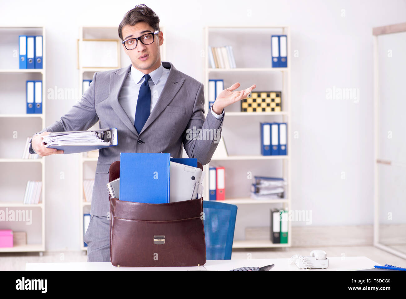 Employee with too much work taking it home Stock Photo - Alamy