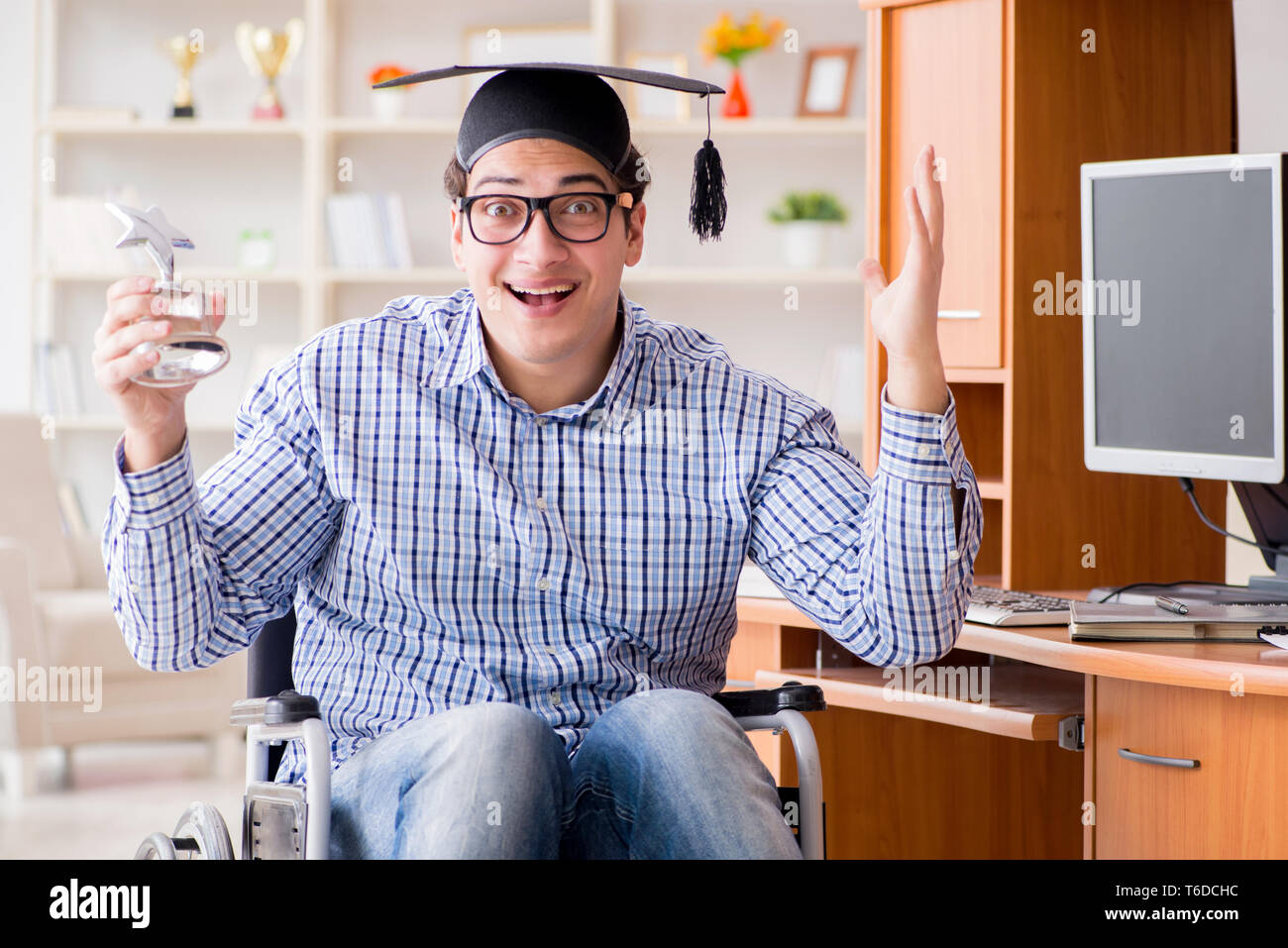 Disabled student studying at home on wheelchair Stock Photo - Alamy