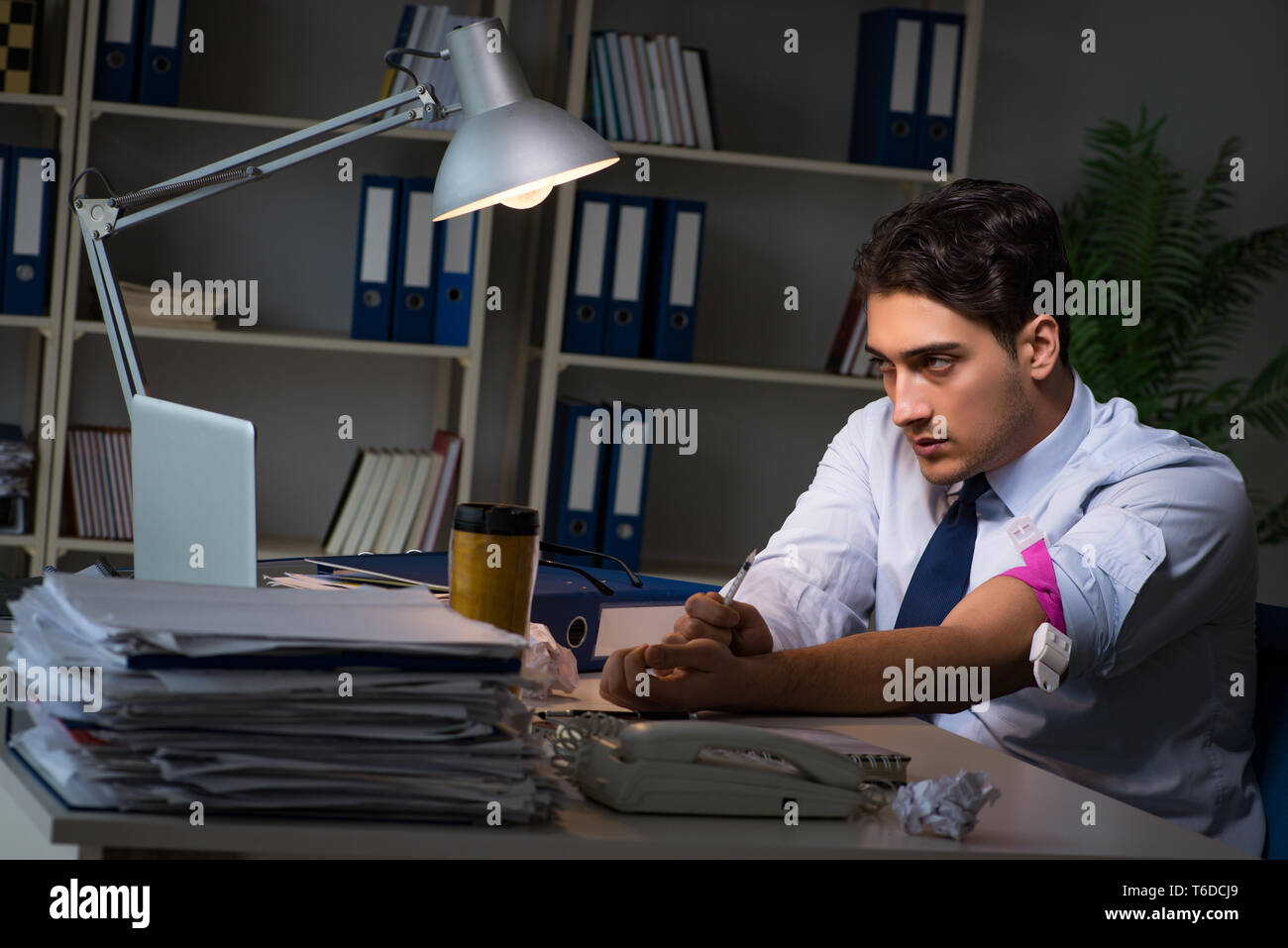 Employee relieving stress from overtime with drugs narcotics Stock ...