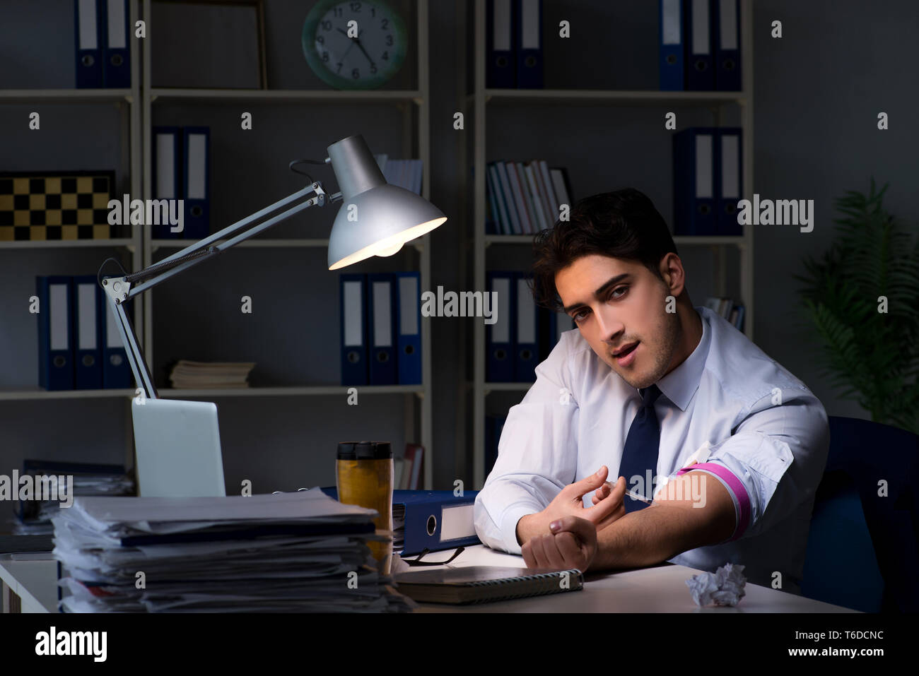Employee relieving stress from overtime with drugs narcotics Stock ...