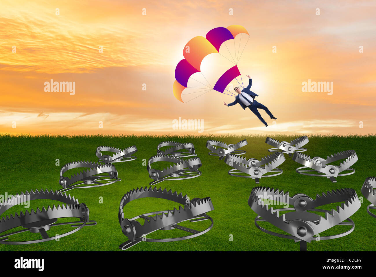 Businessman falling into trap on parachute Stock Photo - Alamy