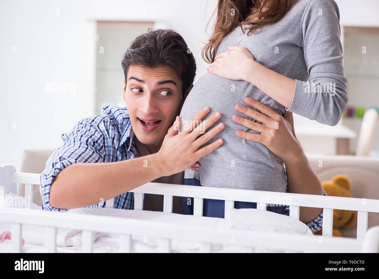 The young parents expecting their first baby hi-res stock photography ...